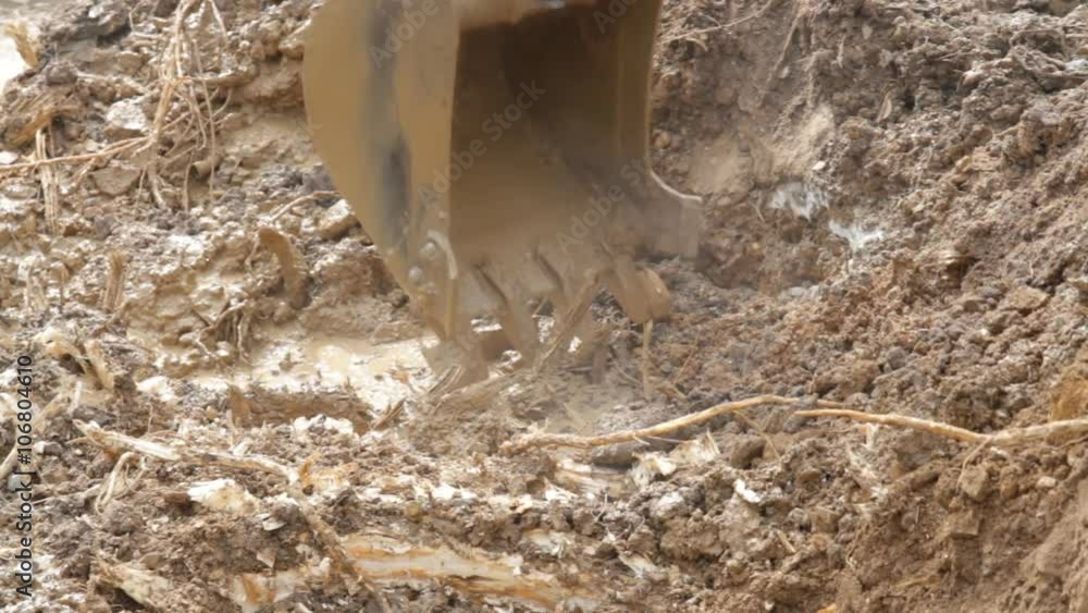 Backhoe digger root remove the soil. Stock Video | Adobe Stock