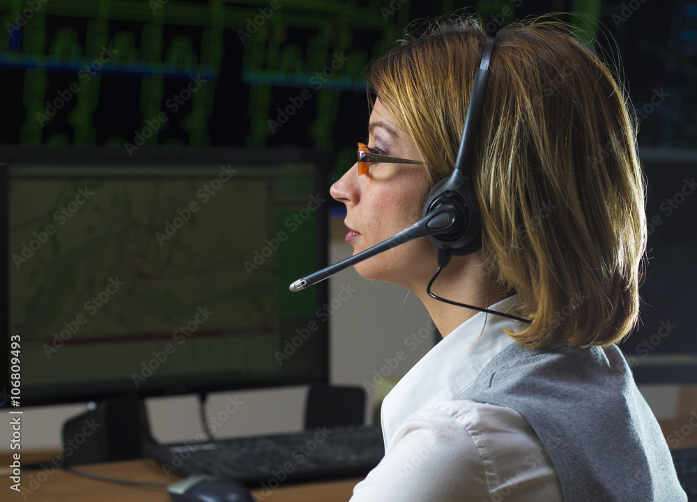 Female operator with headphone in power distribution control ce Stock ...