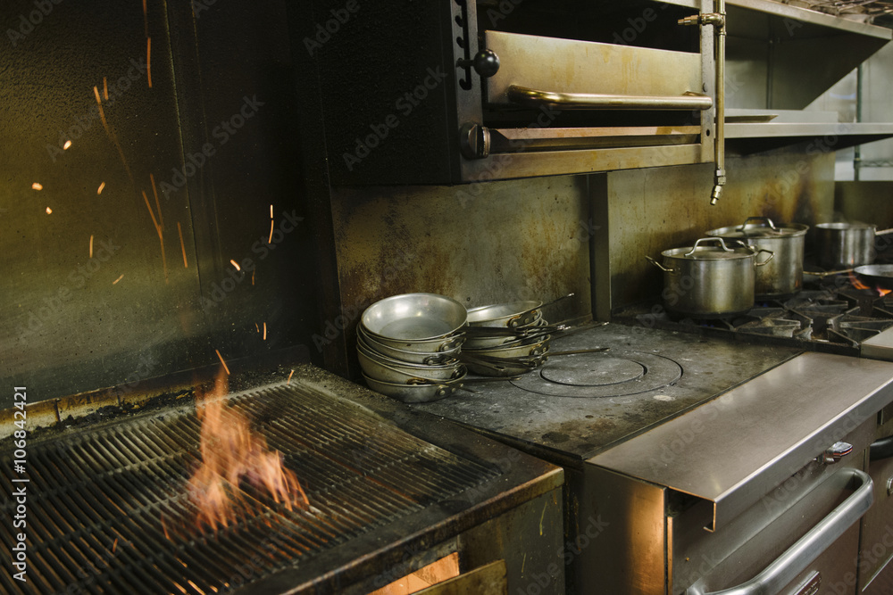 Flaming grill in restaurant kitchen Stock Photo | Adobe Stock