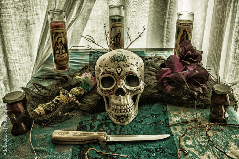 Voodoo Skull Ritual Evil. Voodoo related objects on a table including a ...