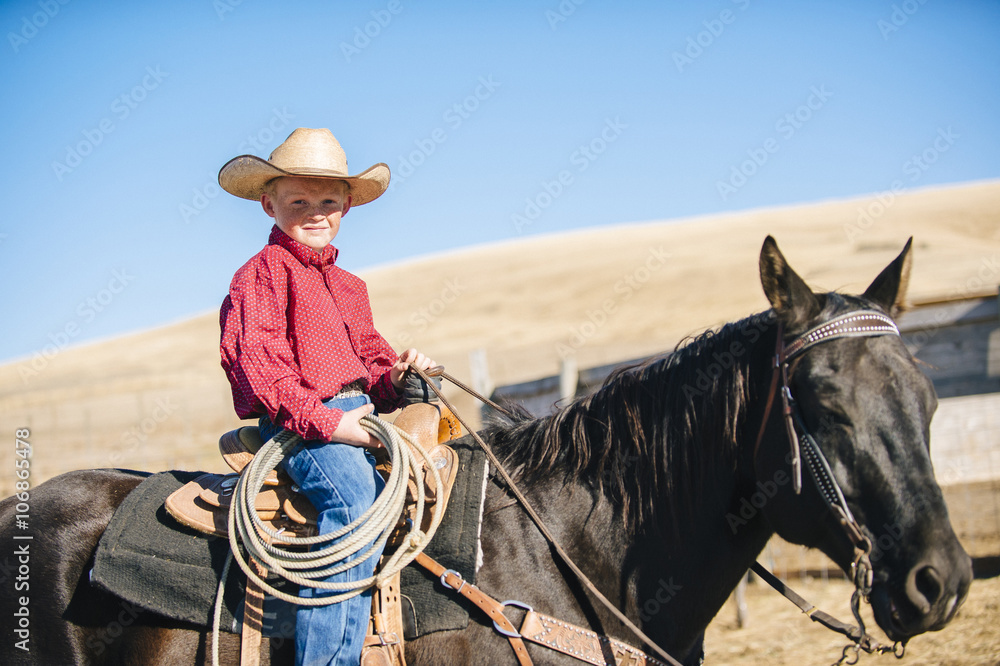 Caucasian boy riding horse on ranch Stock Photo | Adobe Stock