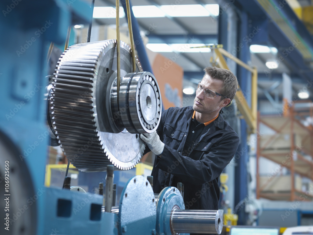 Engineer assembling industrial gearbox in engineering factory Stock ...