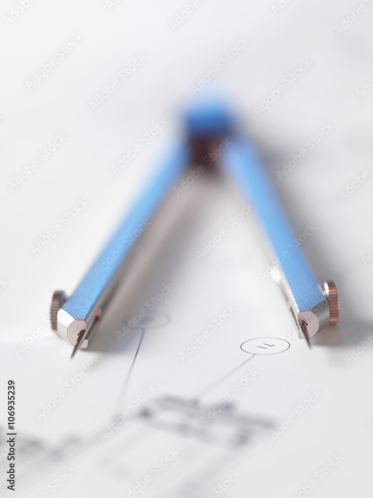 Dividers sitting on engineering drawing used in the measurement of ...