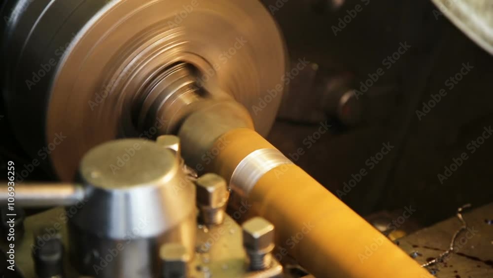 Turning lathe in action.Facing operation of a metal blank on turning ...