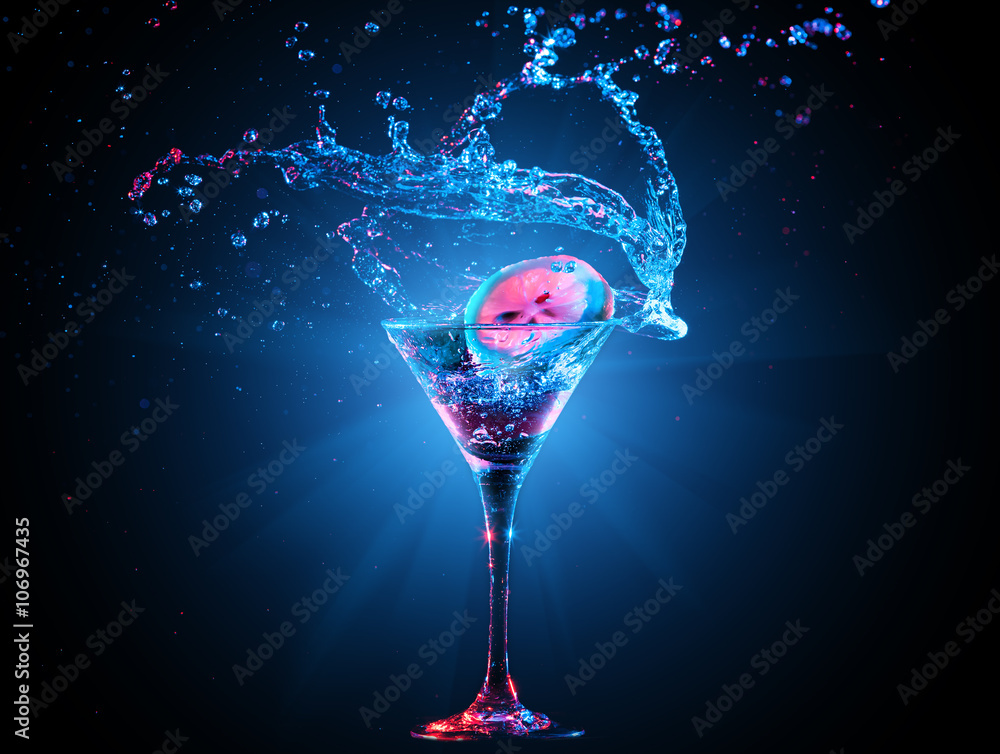 Colourful cocktail in glass with splash Stock Photo | Adobe Stock