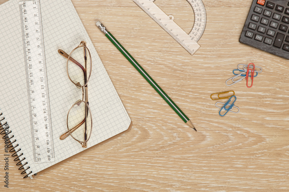 Office table with notebook and pencil, glasses, ruler, calculator Stock ...
