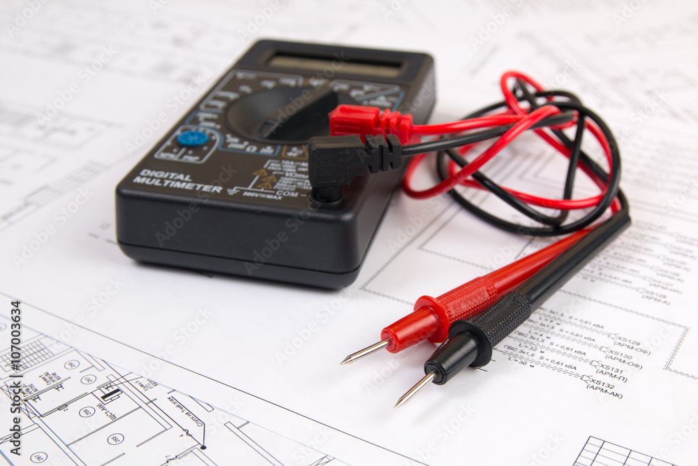 electrical engineering drawings and digital multimeter Stock Photo ...
