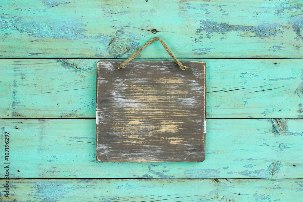 Blank rustic sign hanging on antique mint green wood background Stock ...