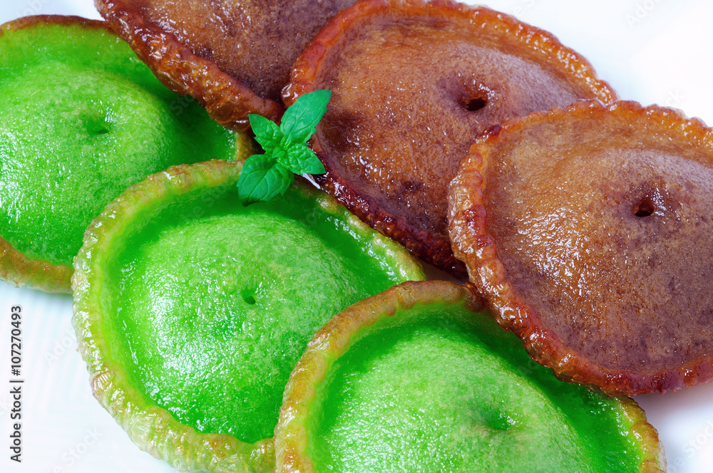 Kuih Pinjaram on a plate. Kuih Pinjaram is a traditional kuih for the ...