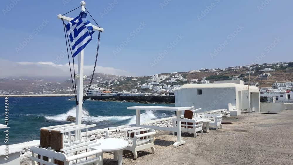 Mykonos Town, Greece - Greek flag-waving at summer. Old port and ...