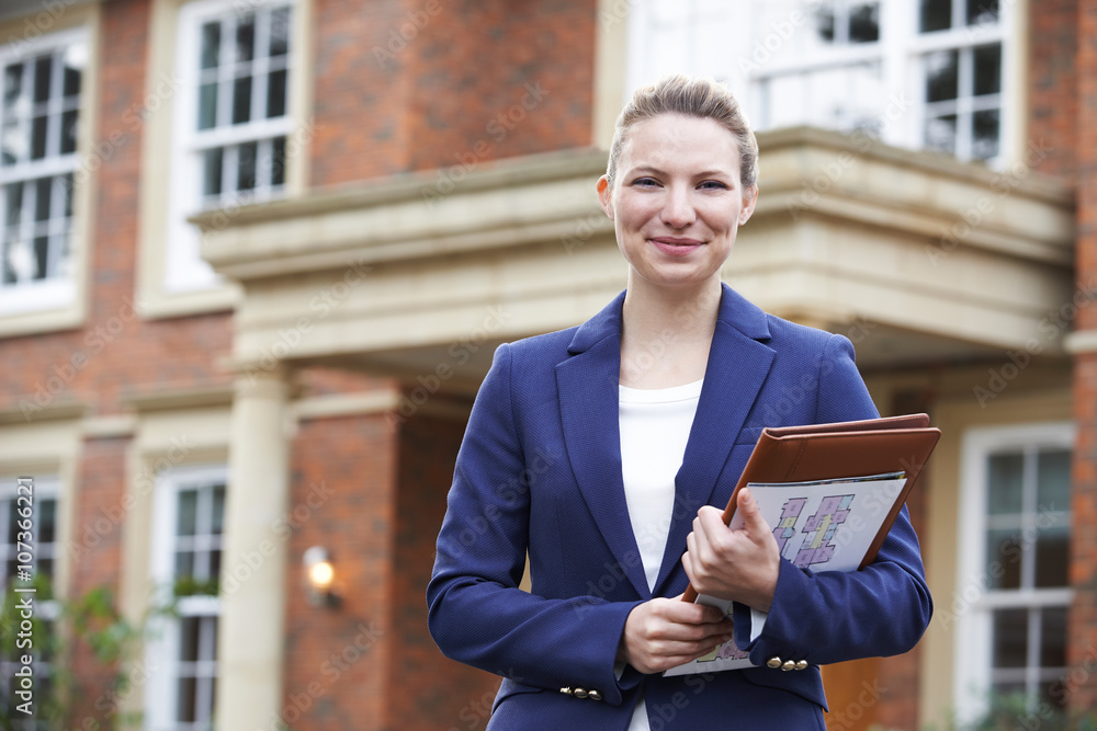 Portrait Of Female Realtor Standing Outside Residential Property Stock ...