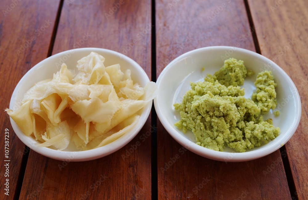Dishes of green wasabi and pickled ginger Japanese condiments Stock ...