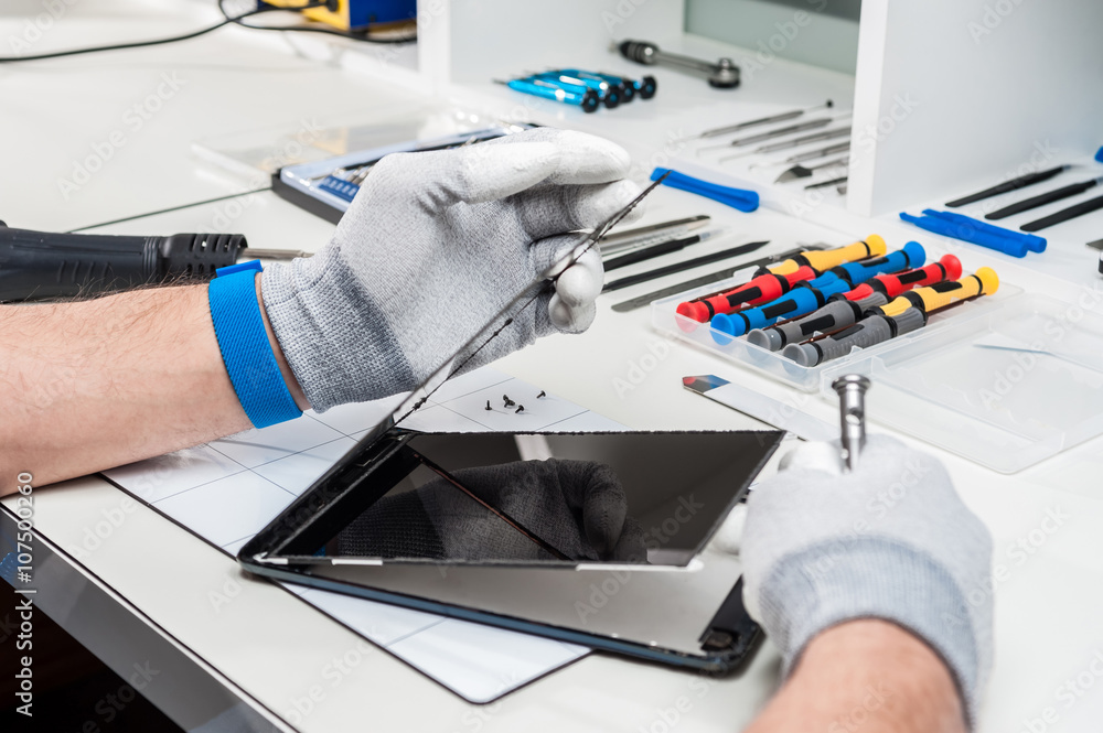 Close-up photos showing process of tablet device repair Stock Photo ...