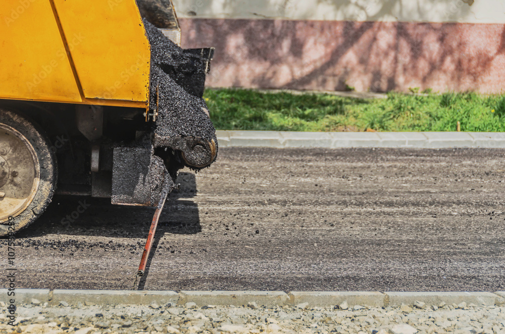 Asphalt spreading machine is ready for paving Stock Photo | Adobe Stock
