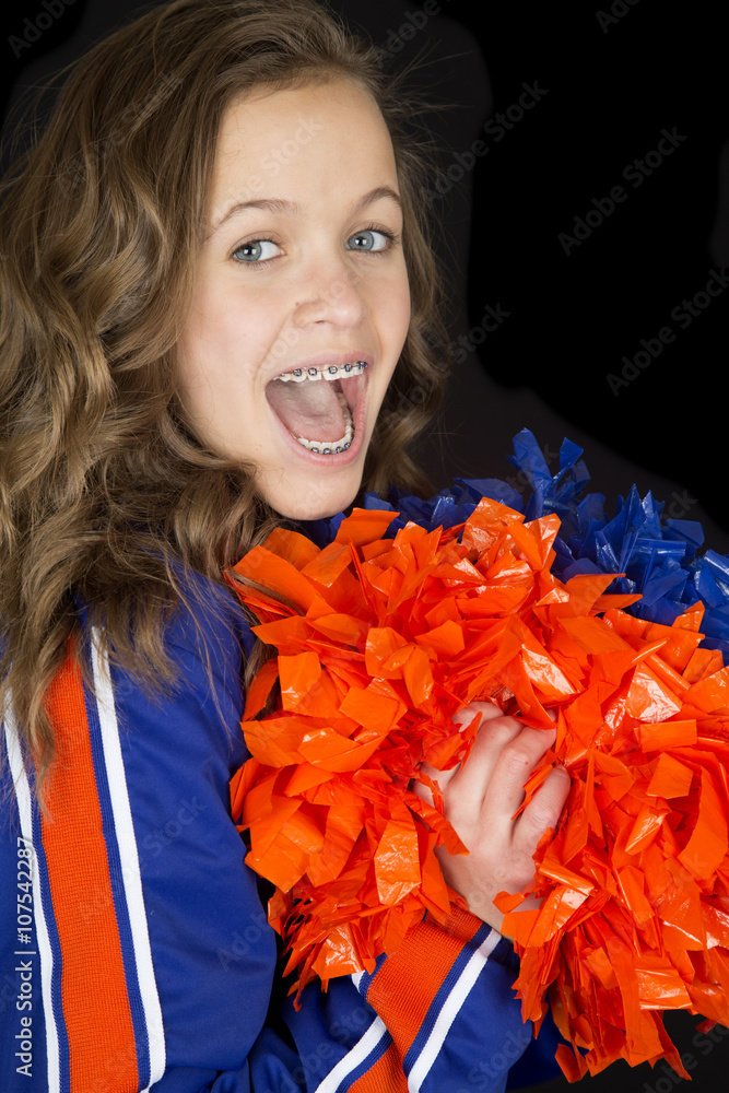 Cute teen cheerleader cheering excited with her mouth open weari Stock ...