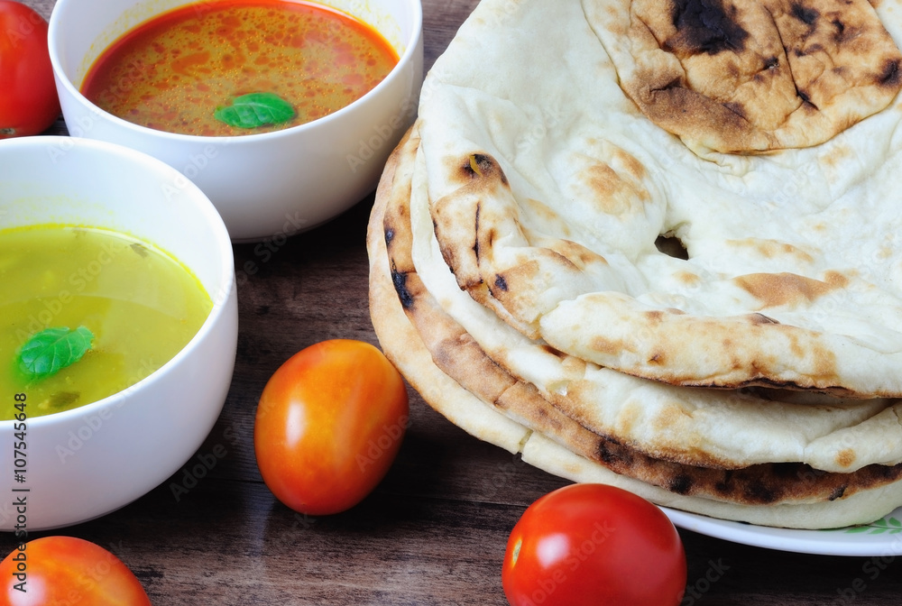 Nepalese/Indian Naan Flatbread with curry and dhal sauce, a plain ...