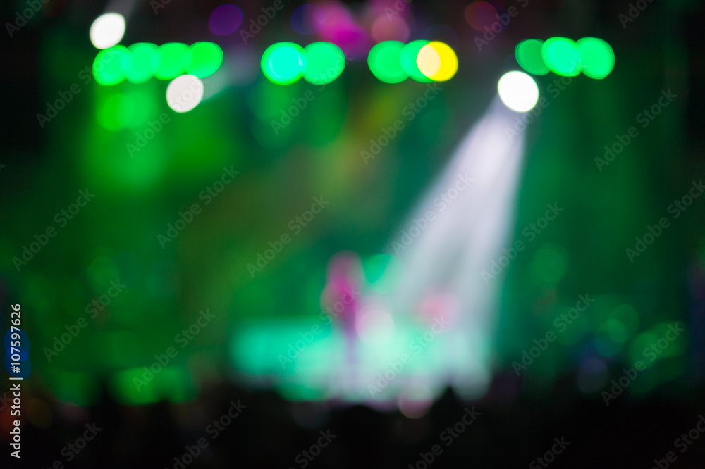 Blurred background : Club, disco DJ playing and mixing music for crowd ...