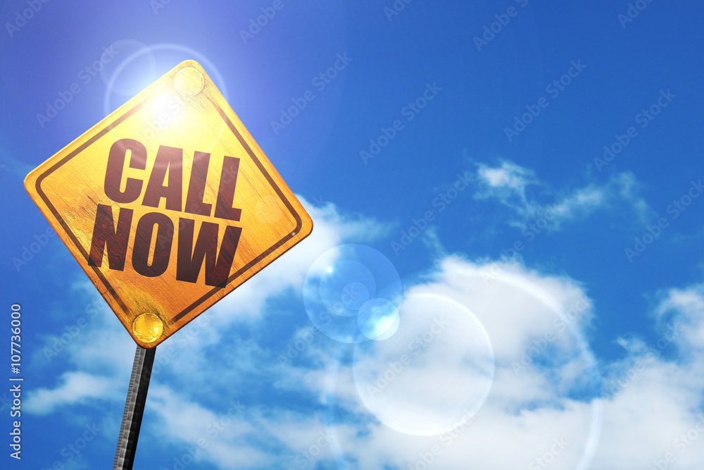 Yellow road sign with a blue sky and white clouds: call now Stock ...