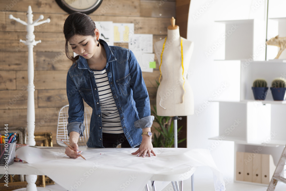 Women are making the clothes of the pattern in the studio Stock Photo ...