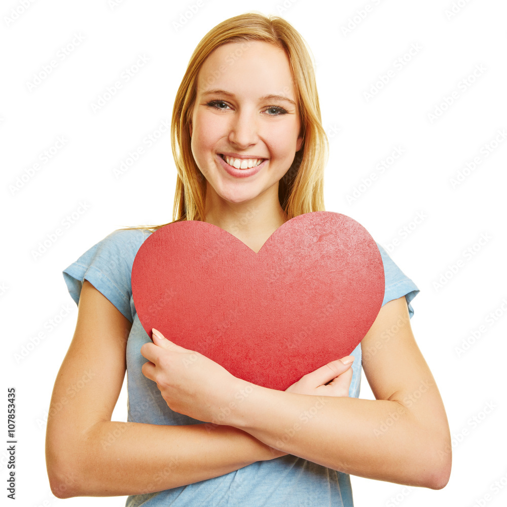 Girl embracing red heart as love symbol Stock Photo | Adobe Stock