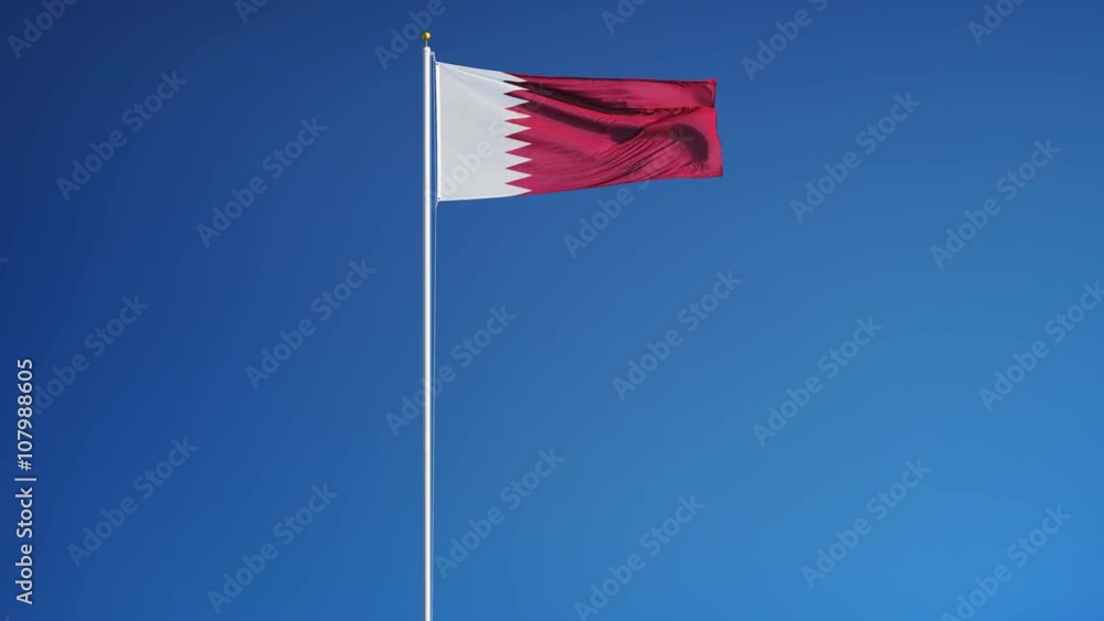 Qatar flag waving in slow motion against clean blue sky, seamlessly ...