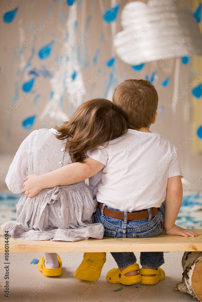 Girl And Boy Hugging In The Rain