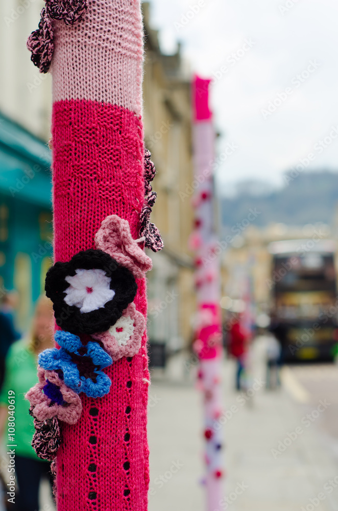 Yarn bombing in Bath, Somerset, UK. An organised group cover poles and ...