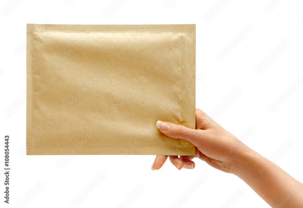 Woman's hand is giving envelope. Studio photography of woman's hand ...
