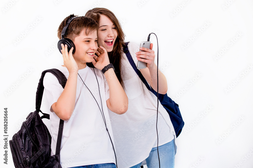 In Brother and sister listen to music with headphones Stock 写真 | Adobe ...