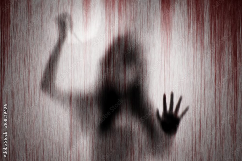 Horror shadow woman figure with a scissors behind the matte gla Stock ...