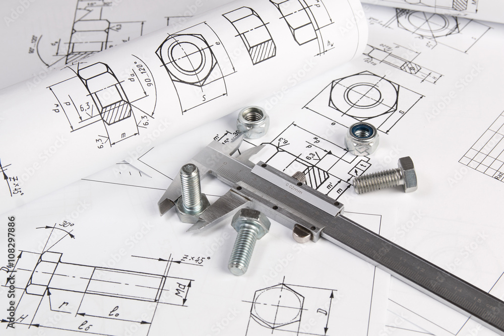 Caliper, bolts and nuts on a background of engineering drawings ...