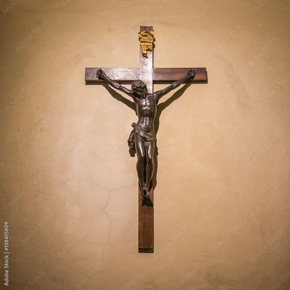 Crucifix on wall in spotlight. Jesus Christ on cross. Religion, belief ...