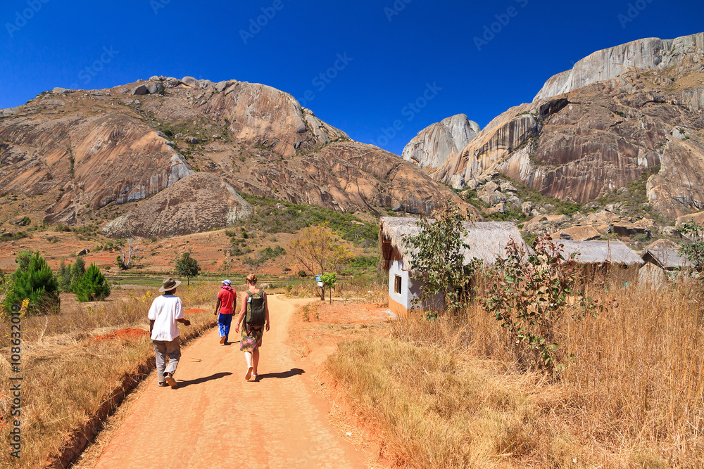 Tourist visiting Anja reserve national park in Madagascar on a ...