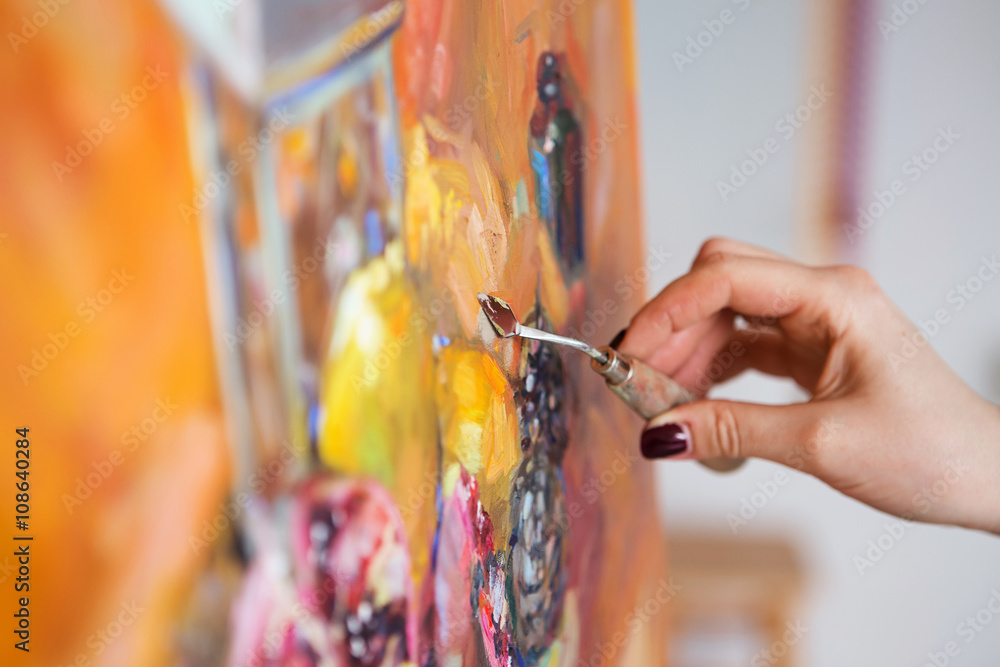 artist paints a picture of oil paint with palette-knife Stock Photo ...