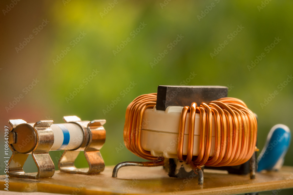 Electromagnetic coil, inductor. Small winding coils and fuses are ...