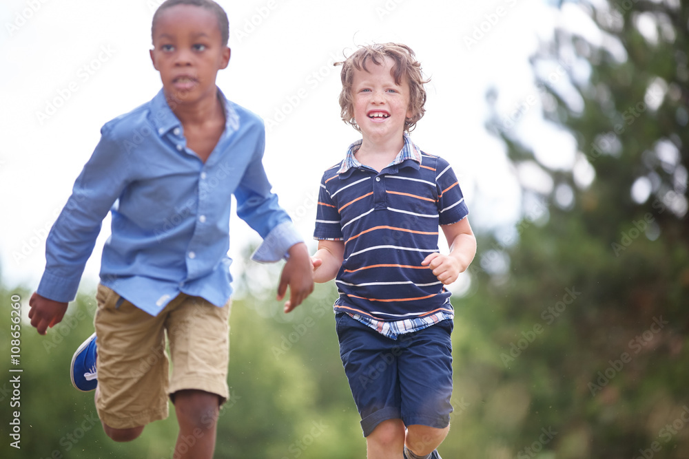 Two boys running Stock Photo | Adobe Stock