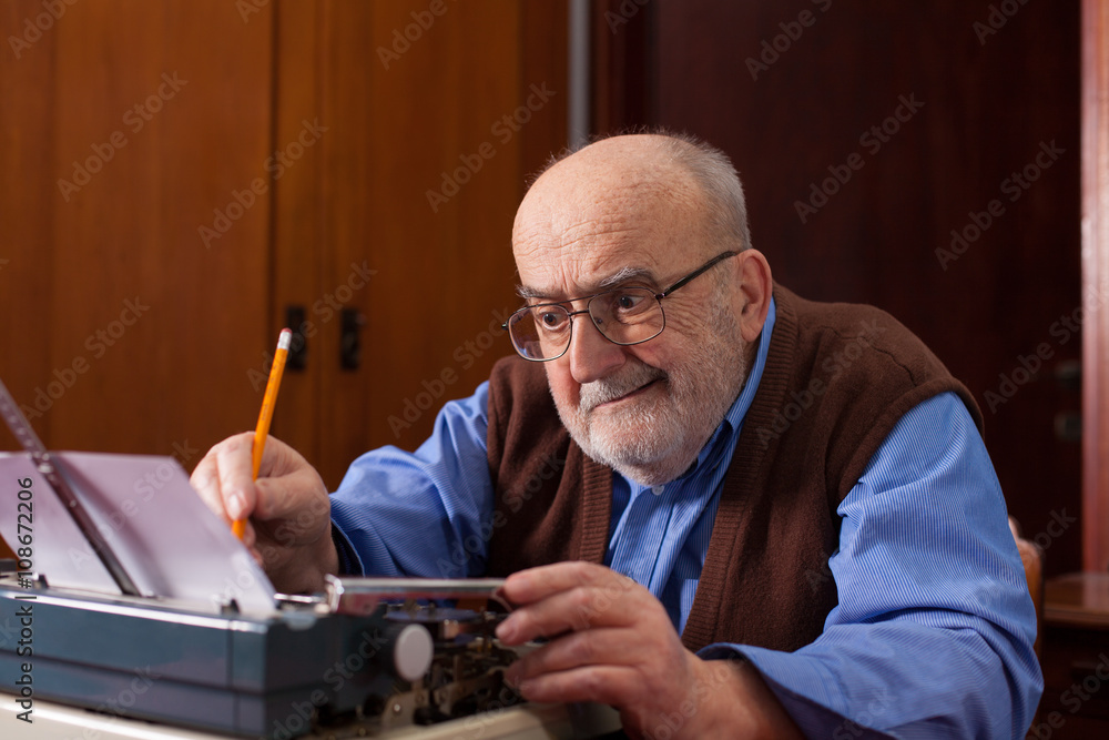old man typing on a typewriter Stock Photo | Adobe Stock