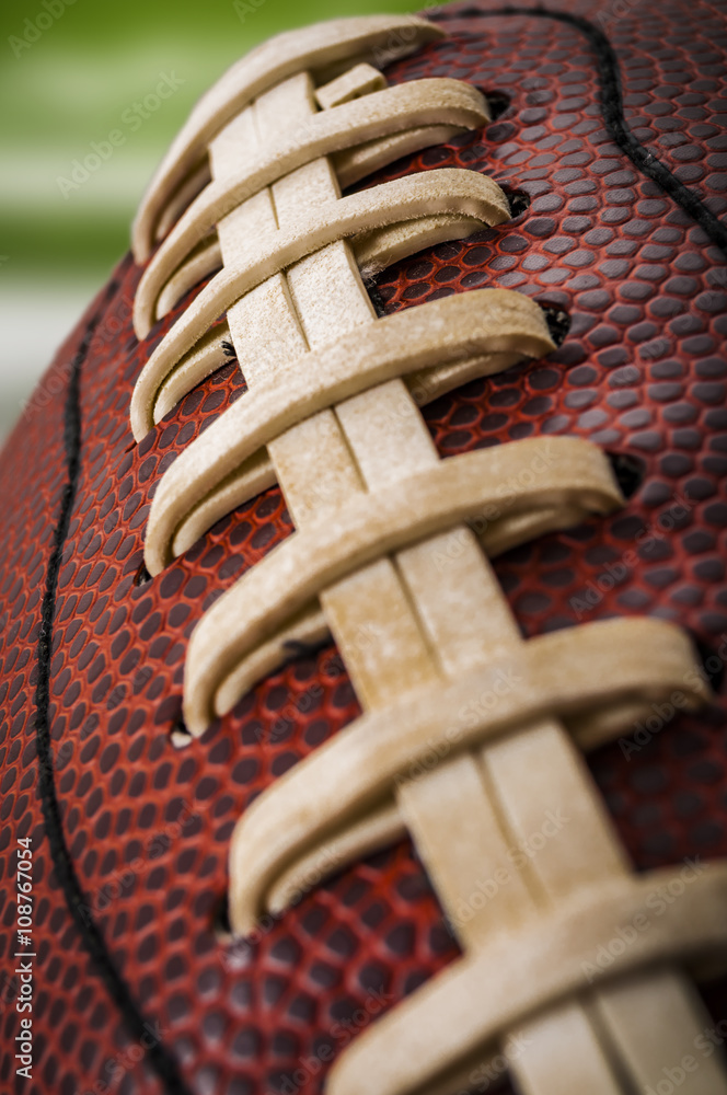 Foto de Macro of a vintage worn american football ball with visible ...