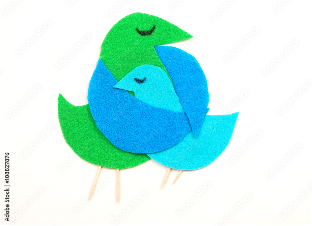 Felt cut out bird shapes in green and blue with toothpick legs and ...