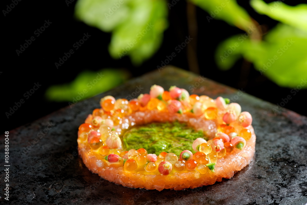Fine dining, fresh raw ahi tuna sashimi with caviar and wild garlic ...