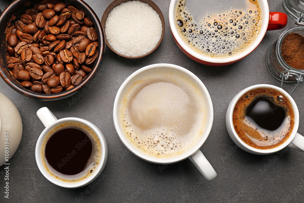Different types of coffee in cups on dark table, top view Stock Photo ...