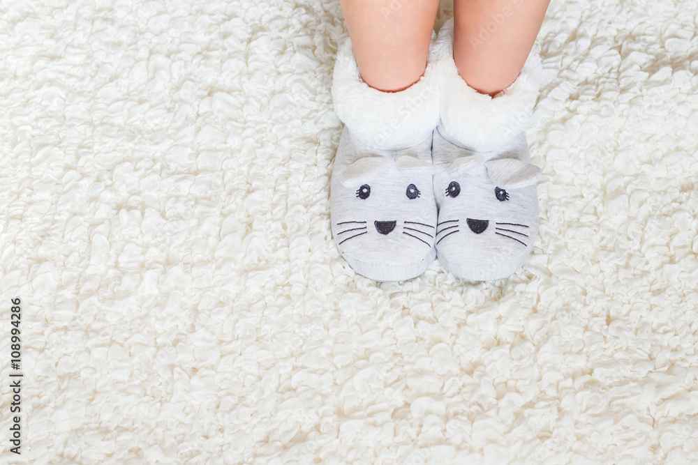 Child. Child's feet in slippers Stock Photo | Adobe Stock