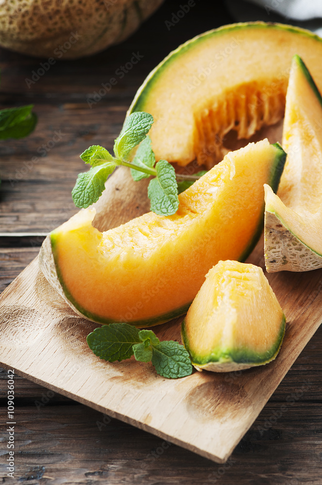 Sweet orange melon on the wooden table Stock Photo | Adobe Stock