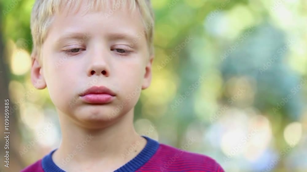 Little child was bitten by bee on finger unexpectedly. Close up ...