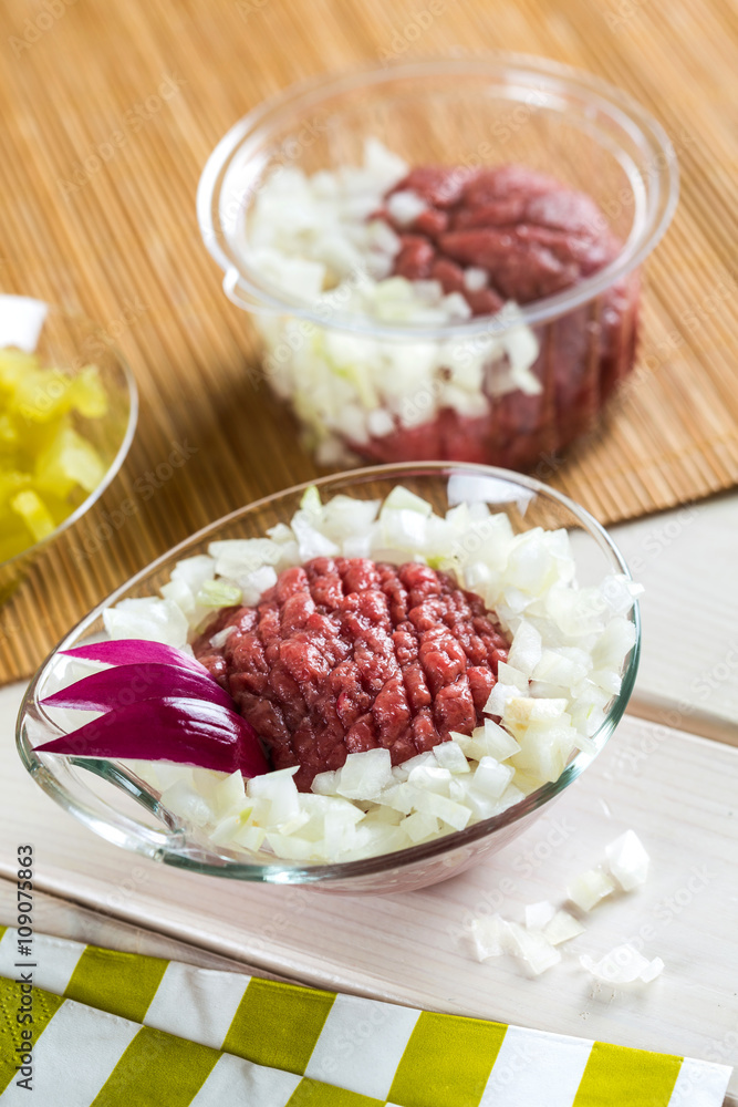 Dish with raw seasoned meat called "Tatar" with chopped onion Stock ...
