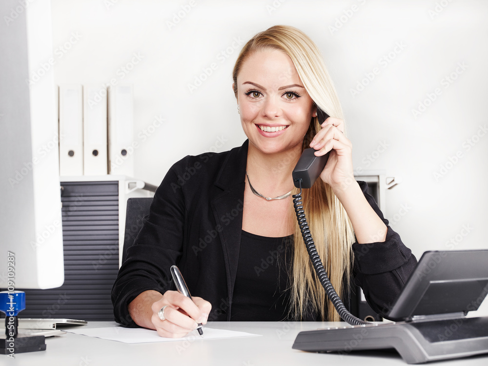 Female office assistant has a call at the office Stock-Foto | Adobe Stock