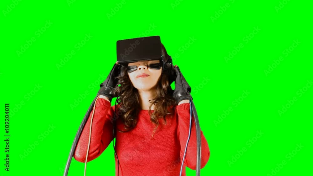 A slow-dancing girl, wearing a virtual reality headset and wired gloves ...