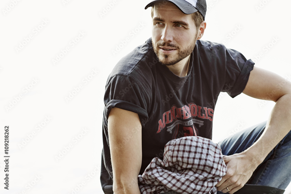 Young man looking away Stock Photo | Adobe Stock