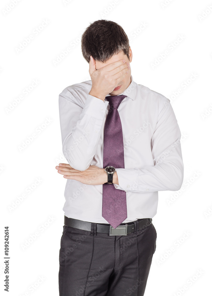 young businessman covering his eyes with his hand. emotions, facial ...