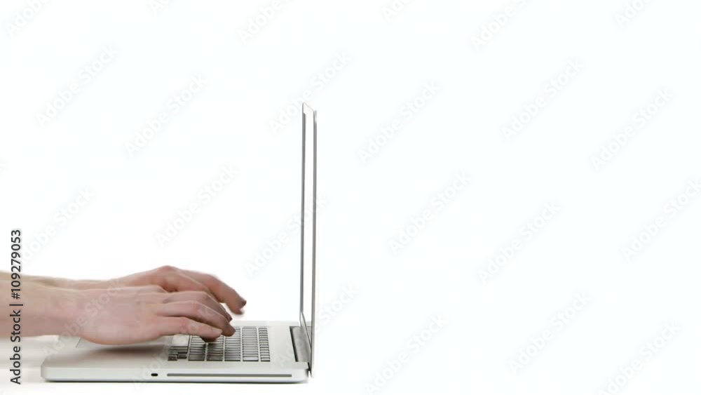 Vidéo Stock Hands type on a laptop computer, while the right side of ...